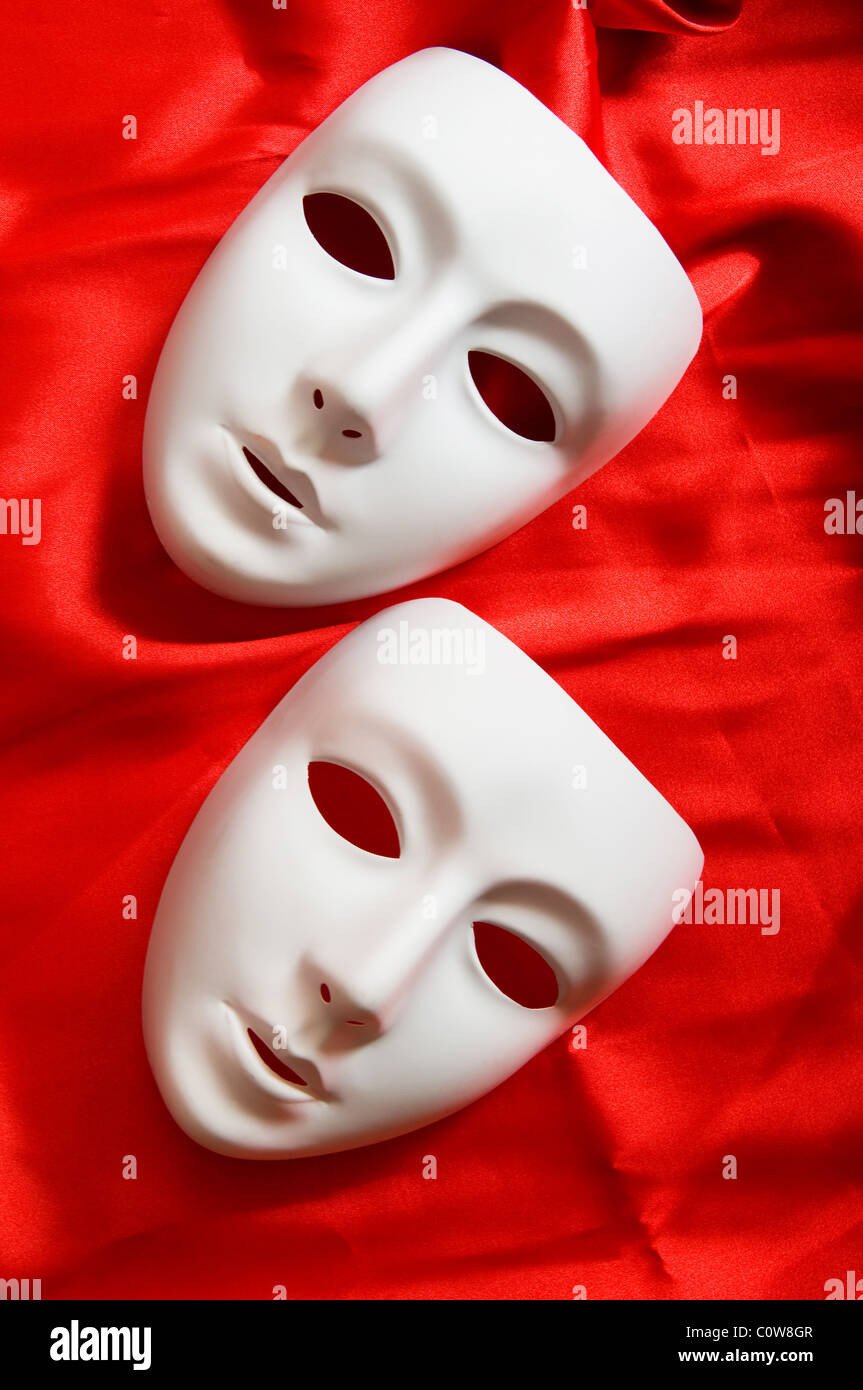 Theatre concept with the white plastic masks Stock Photo - Alamy