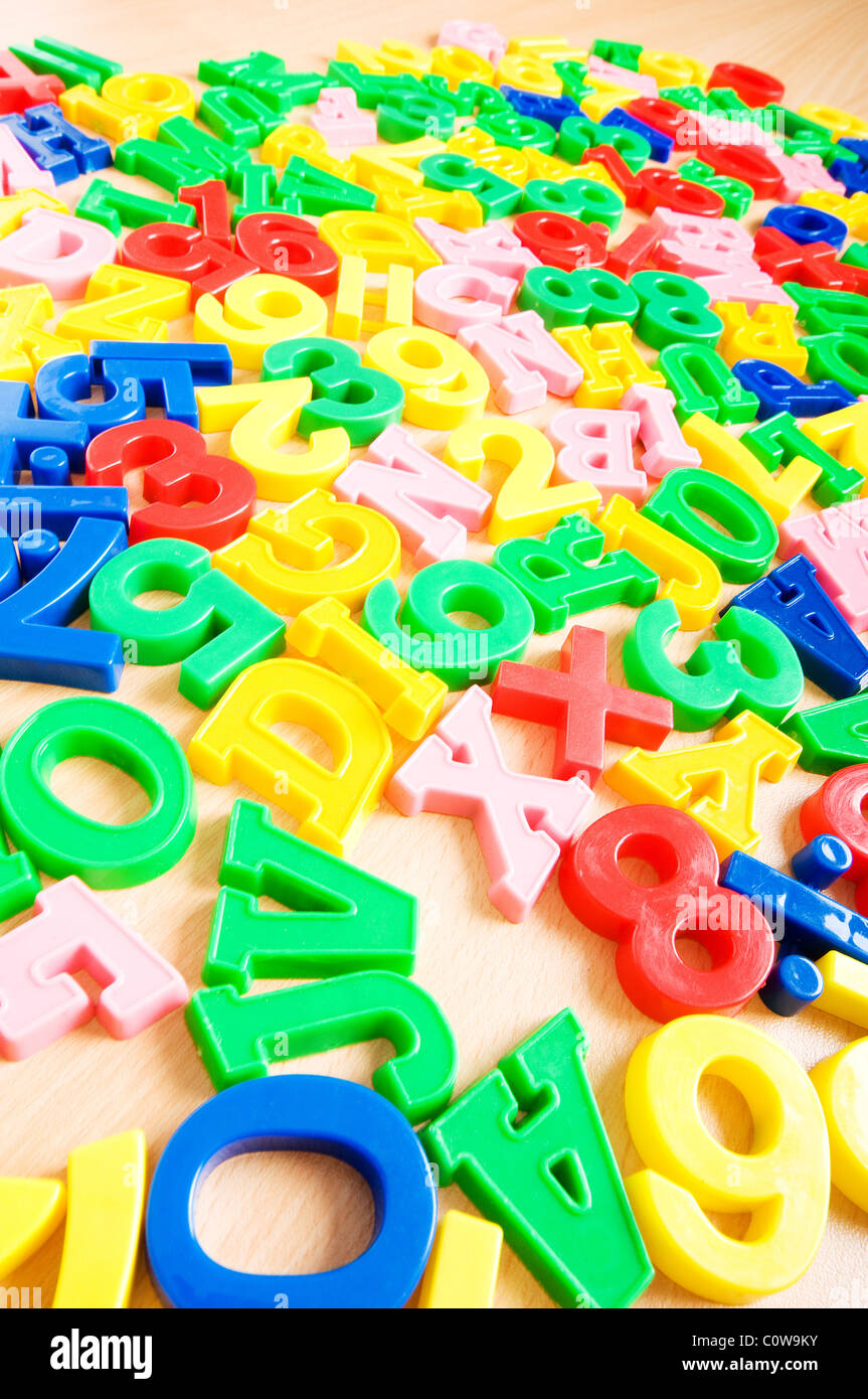 Children letters and digits on the table Stock Photo - Alamy