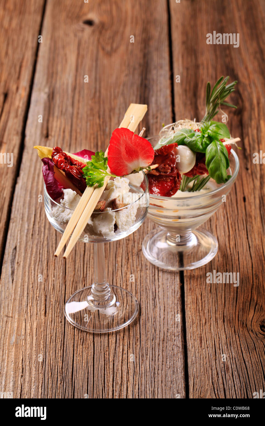 Various cheese appetizers in glass dishes - still life Stock Photo - Alamy
