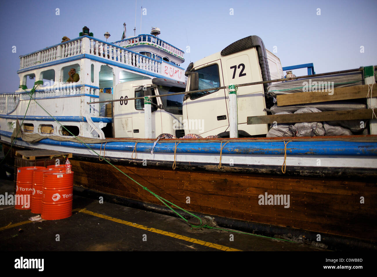 A traditional dhow loaded with lorries in the dhow wharfage, Dubai, UAE ...