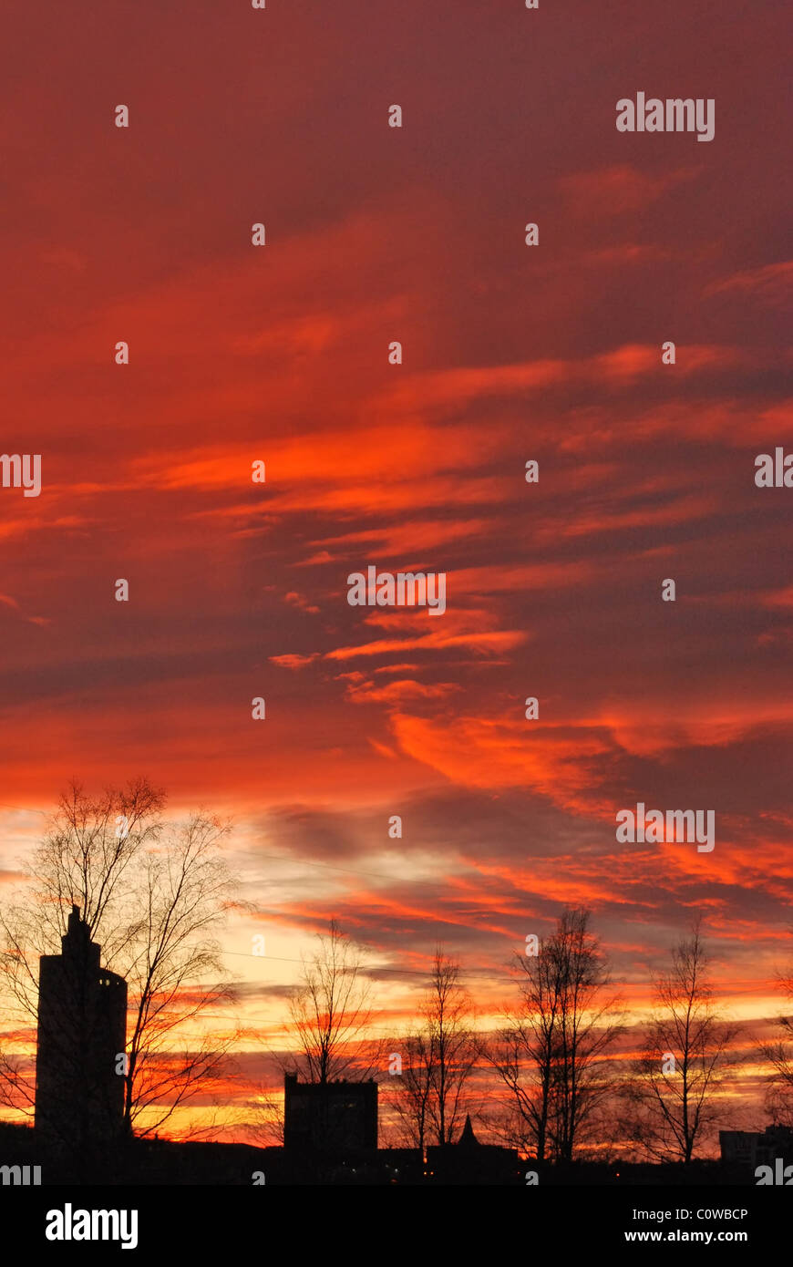 sunset over buildings silhouette in city Stock Photo - Alamy