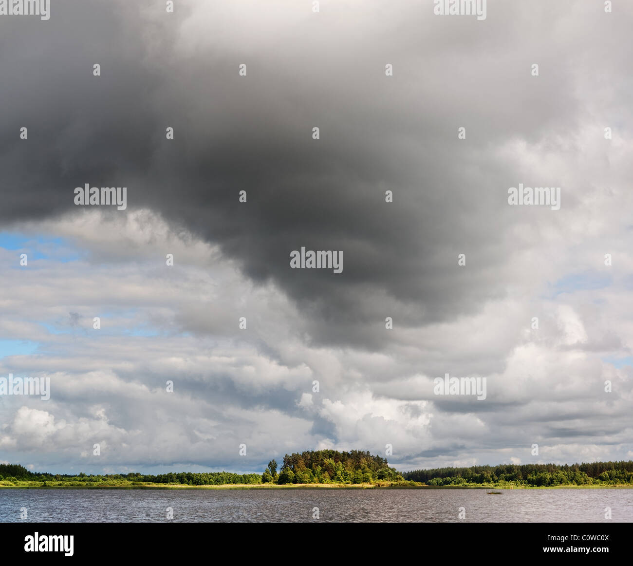 Cloudy day on lake with rain weather Stock Photo - Alamy