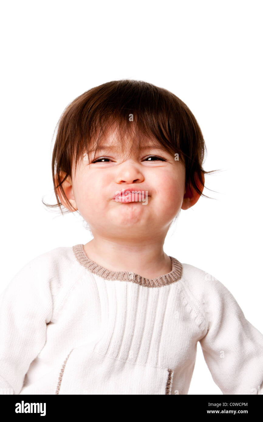 Face of baby toddler infant child with funny expression and mischievous ...