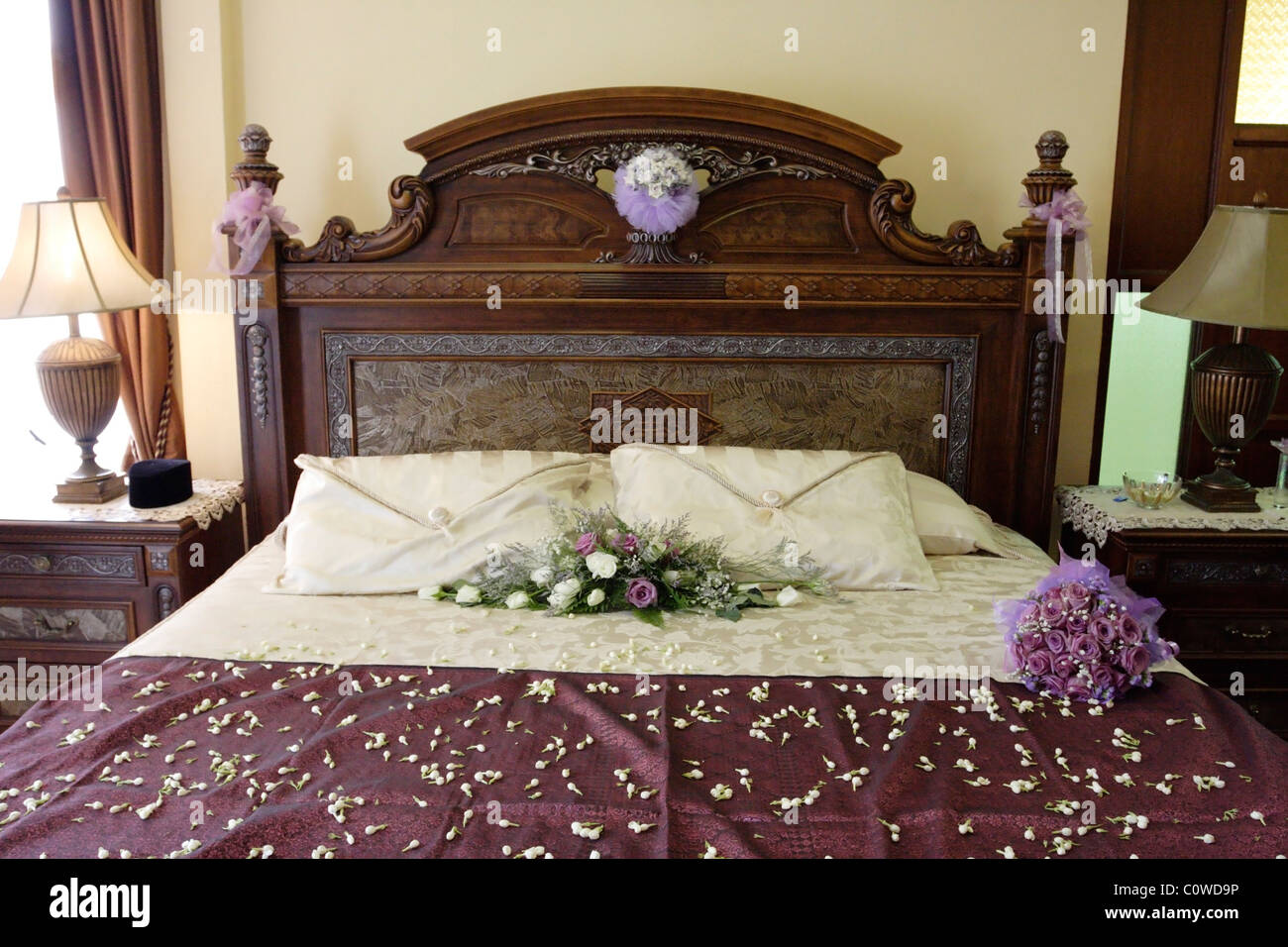 Decorated wooden bed Stock Photo - Alamy