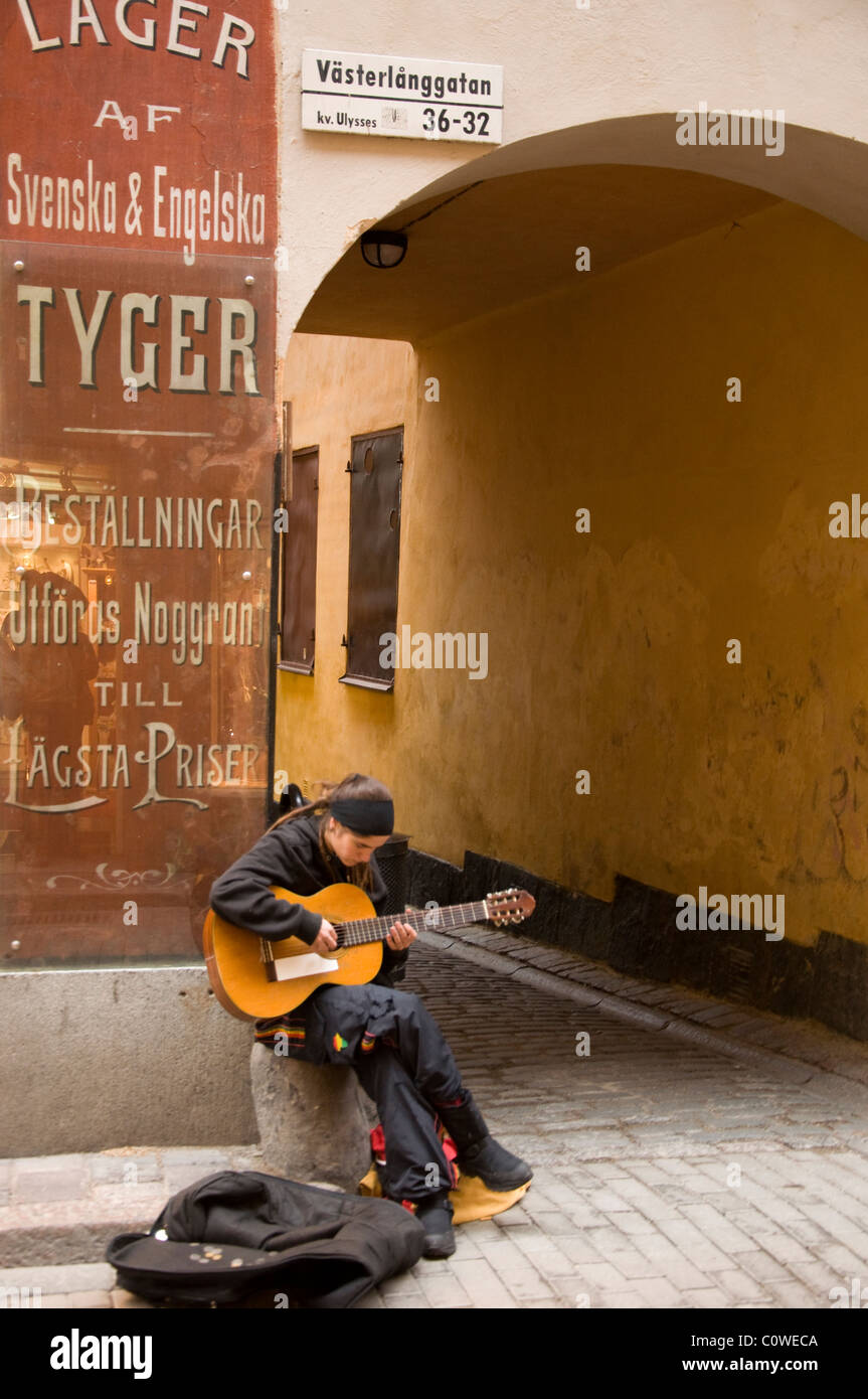 A young guitar player and singer in Gamla Stan, Stockholm Sweden Stock ...