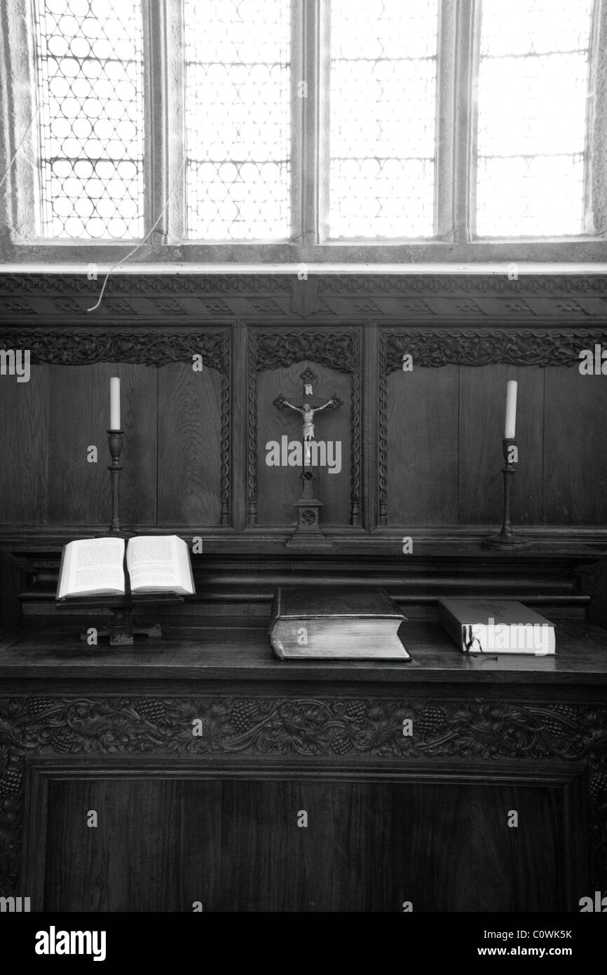 All Saints Church, Holbeton, Devon, bibles, candles and cross Stock ...