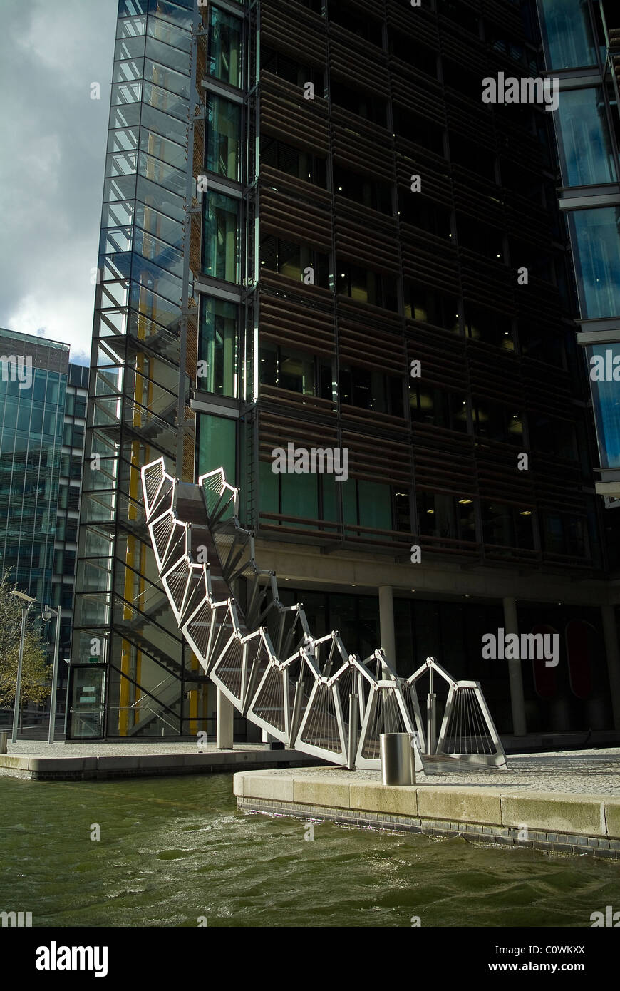 Heatherwick Studio's Rolling Bridge at Paddington Basin, London, UK ...