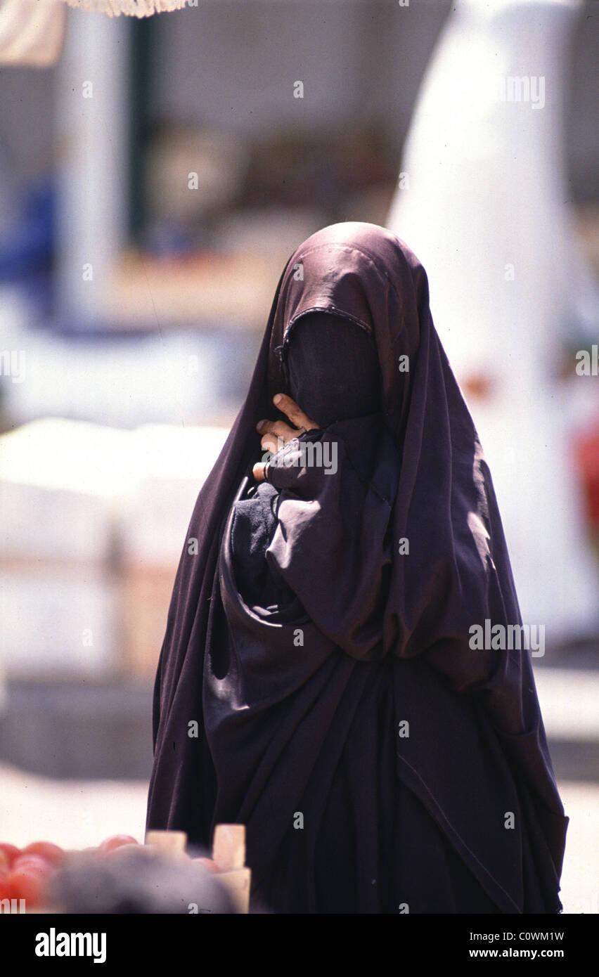 qatif, saudi arabia -- a saudi woman shopping at the local outdoor ...