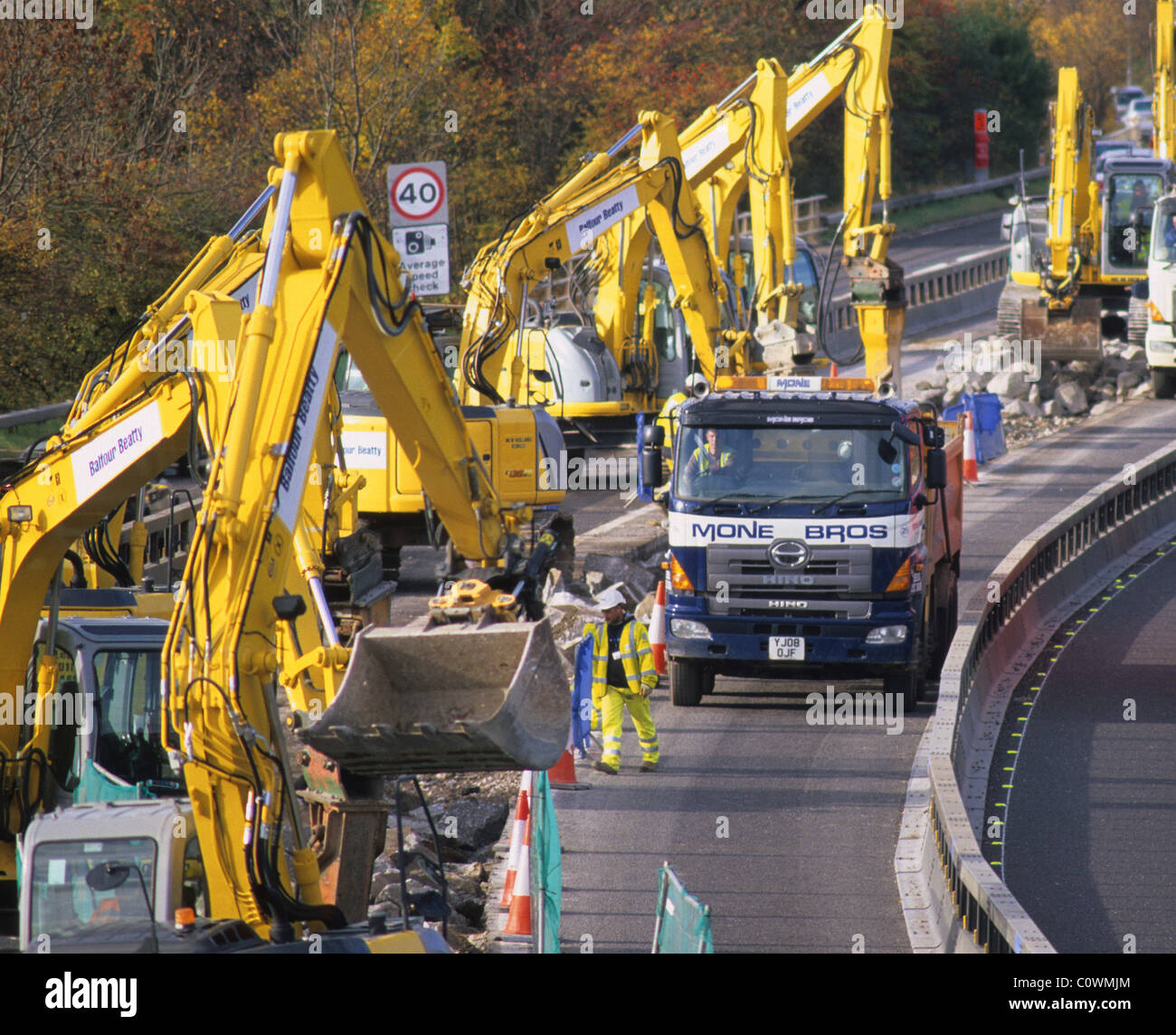 diggers at roadworks on the M621 motorway filling lorrys with rubble ...