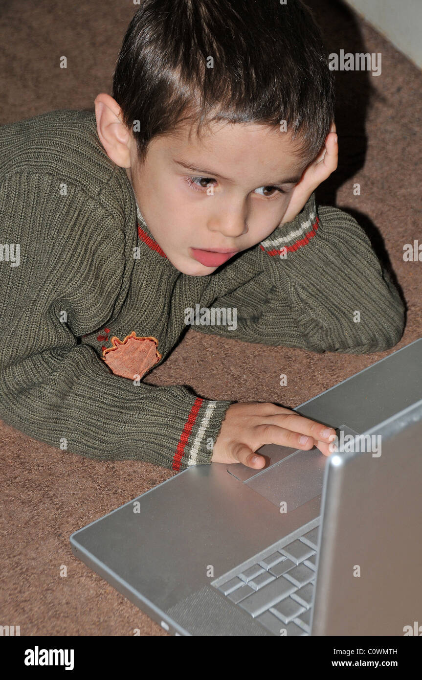 young boy ( five years ago) before computer Stock Photo - Alamy