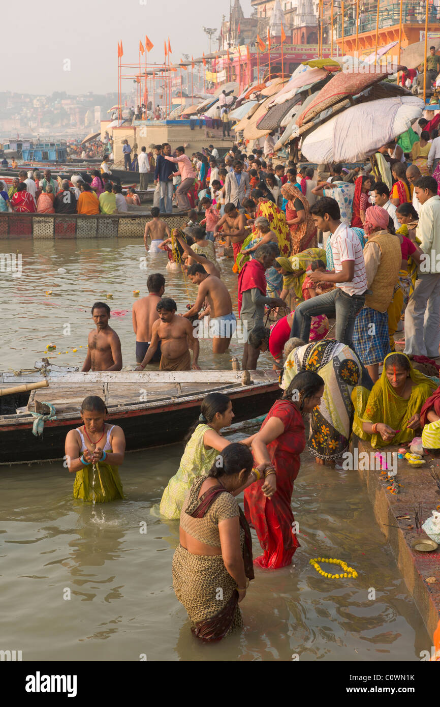 Pilgrims bathing in the River Ganges at Man Mandir Ghat, Varanasi ...