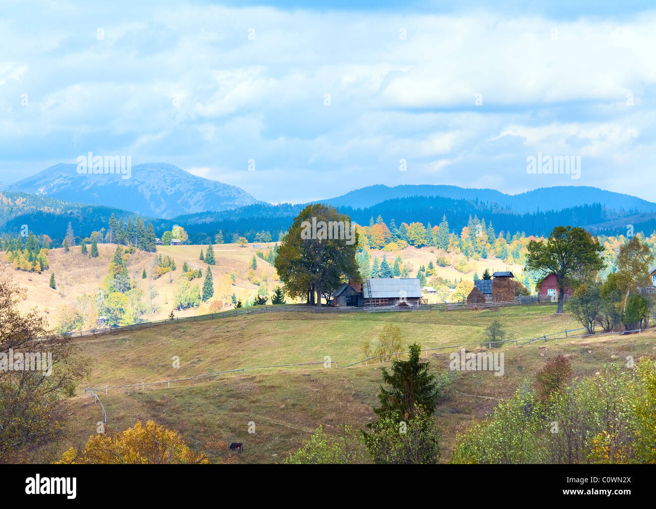 Autumn countryside landscape with village on mountainside Stock Photo ...