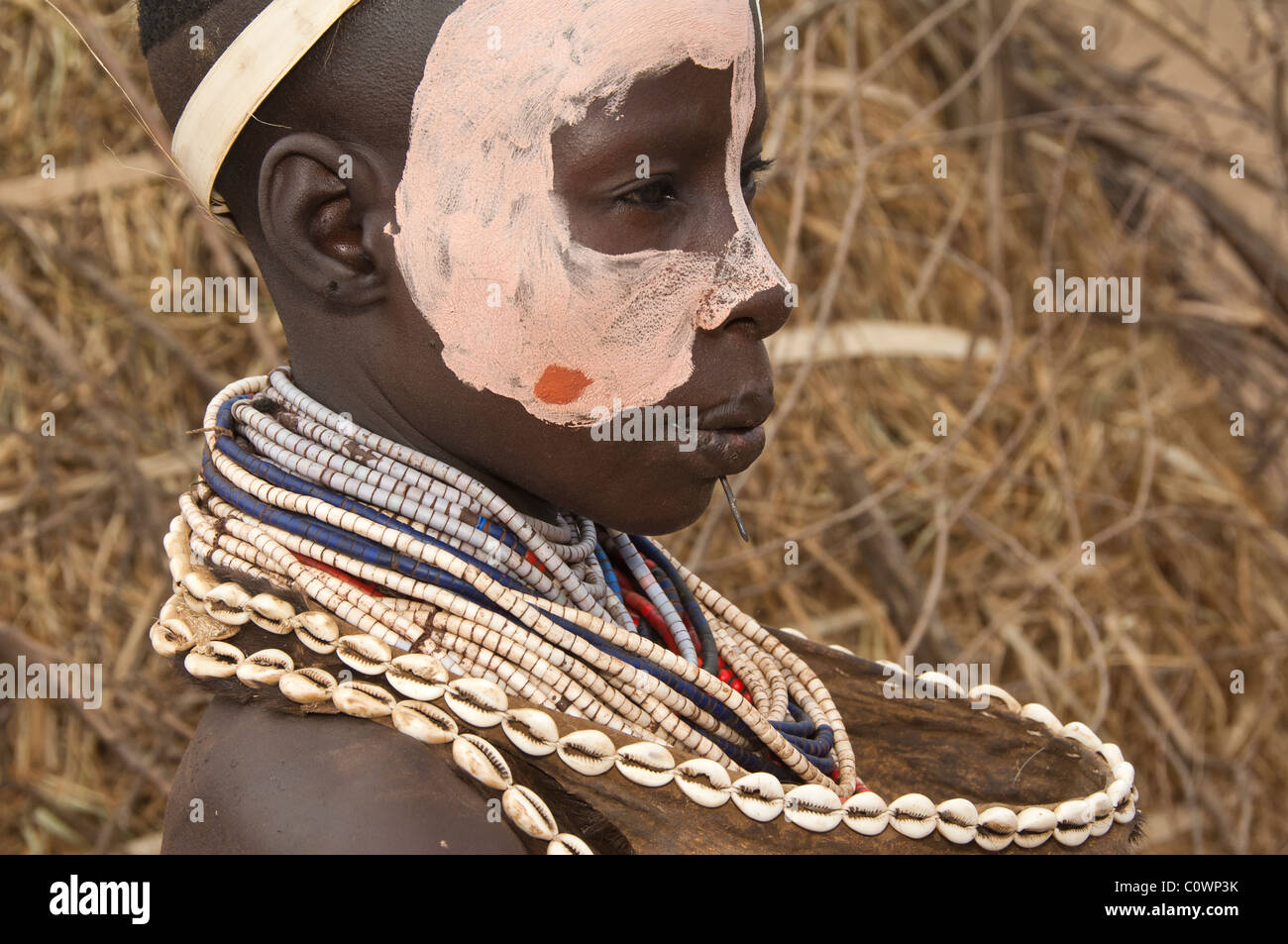 Karo woman with face paintings and lots of colorful necklaces and Cowry ...