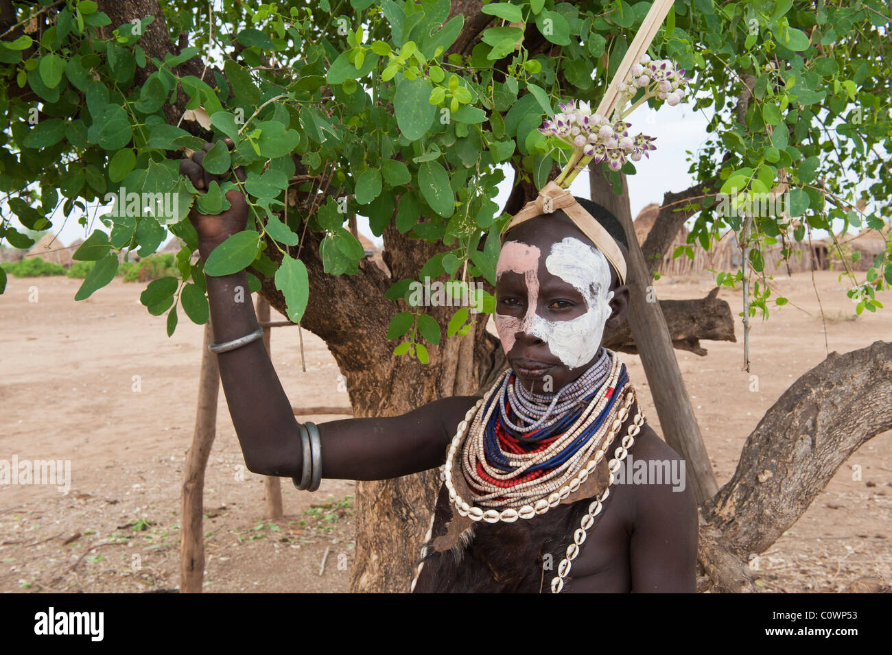Karo woman with face paintings and lots of colorful necklaces and Cowry ...
