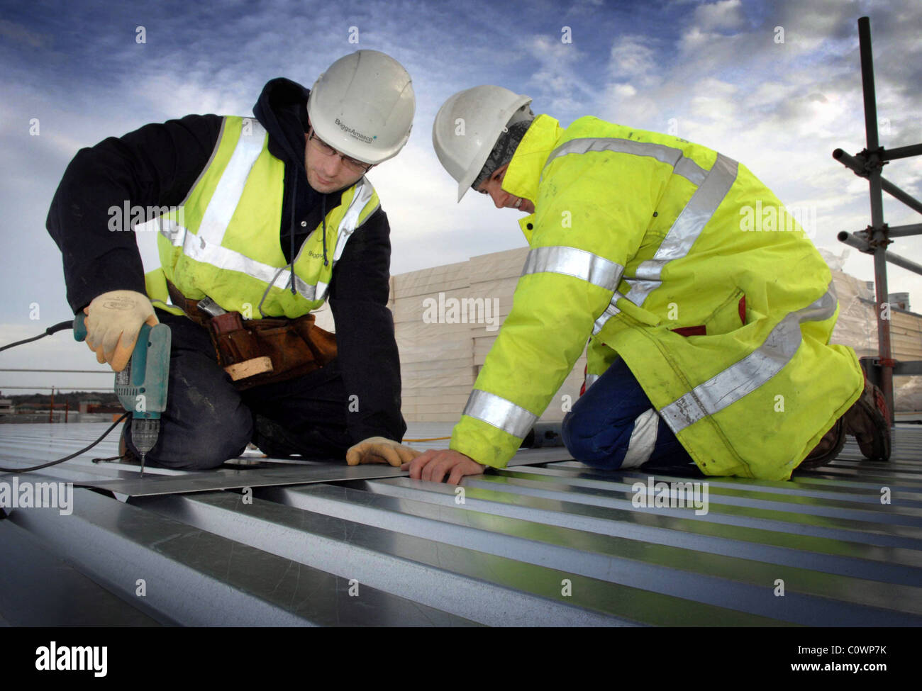 Construction workers working on office building roof, Edinburgh ...
