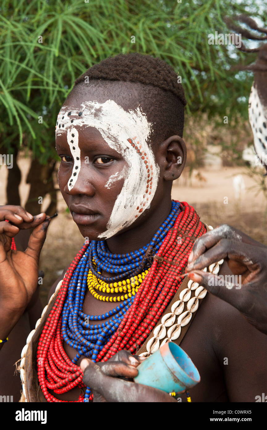 Make-Up session for a young Karo woman, Omo river valley, Southern ...