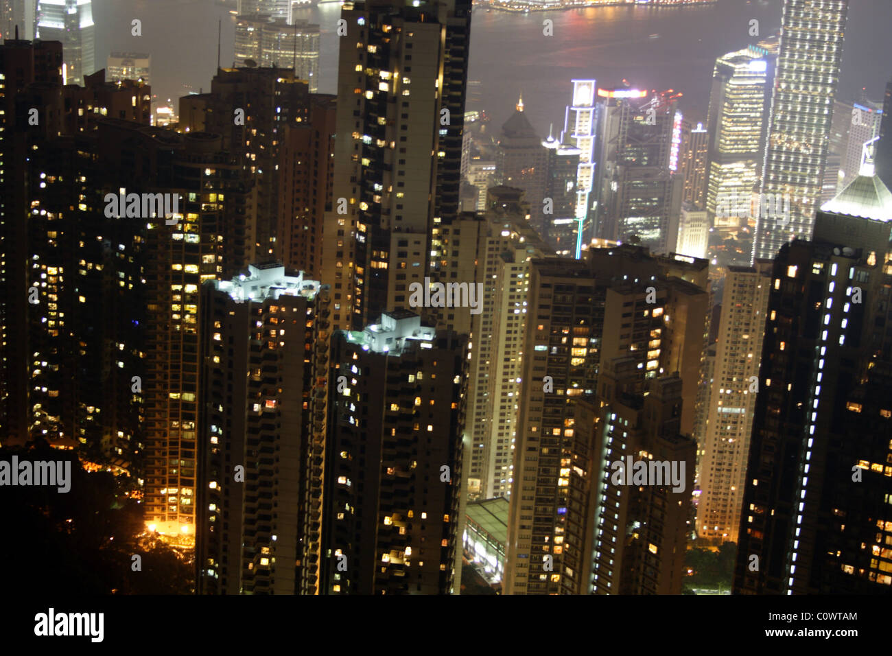 Hong Kong, China, on a cloudy night. Showing hi-rise buildings and ...