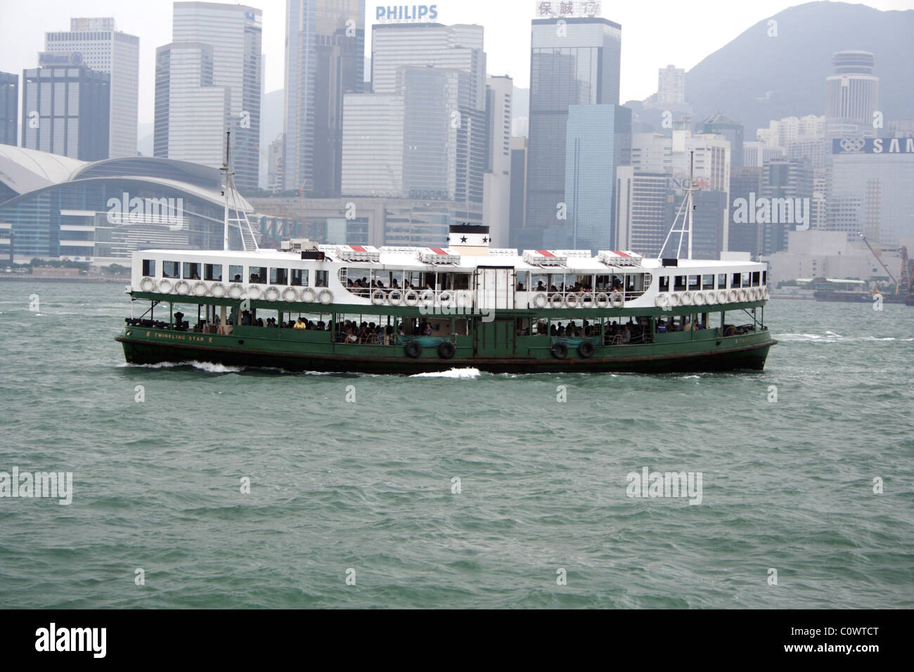 Ferry taking passengers between Hong Kong Island and mainland Kowloon ...