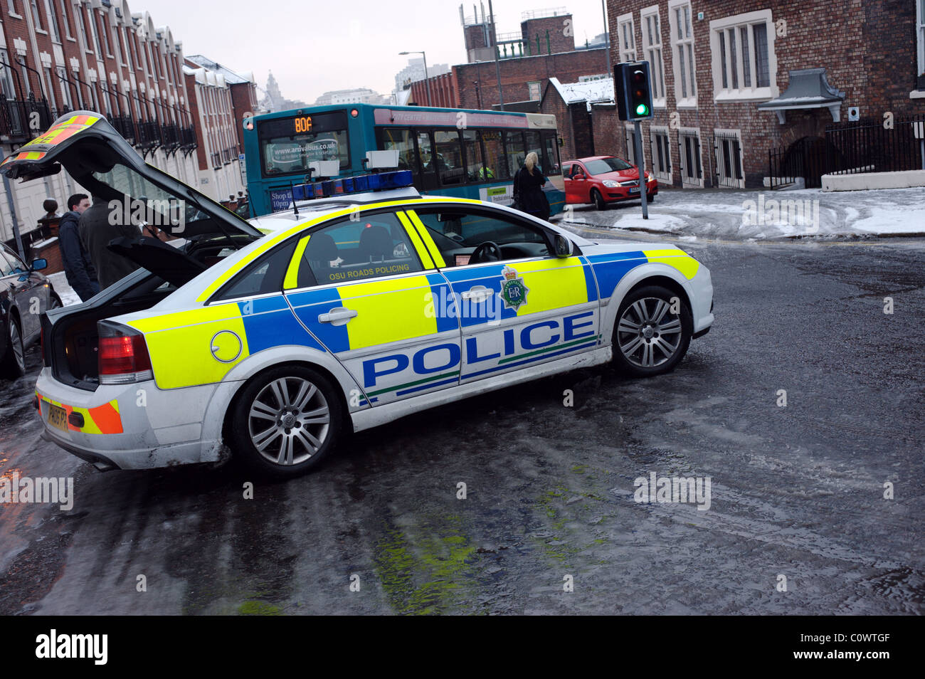 Police car blocks road in Liverpool after a bus skids on ice Stock ...