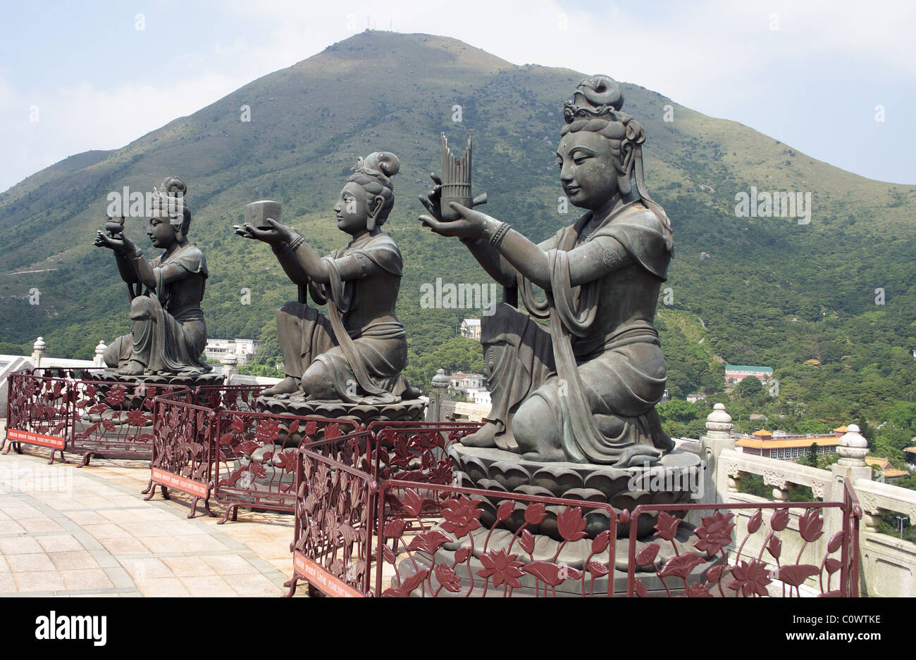 Three of eight bronze statues representing Gods or immortals. Making ...