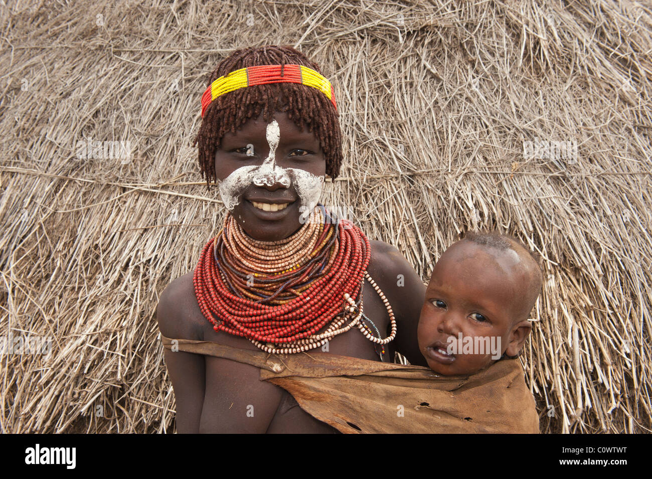 Karo woman with lots of colorful necklaces and a baby, Omo river valley ...