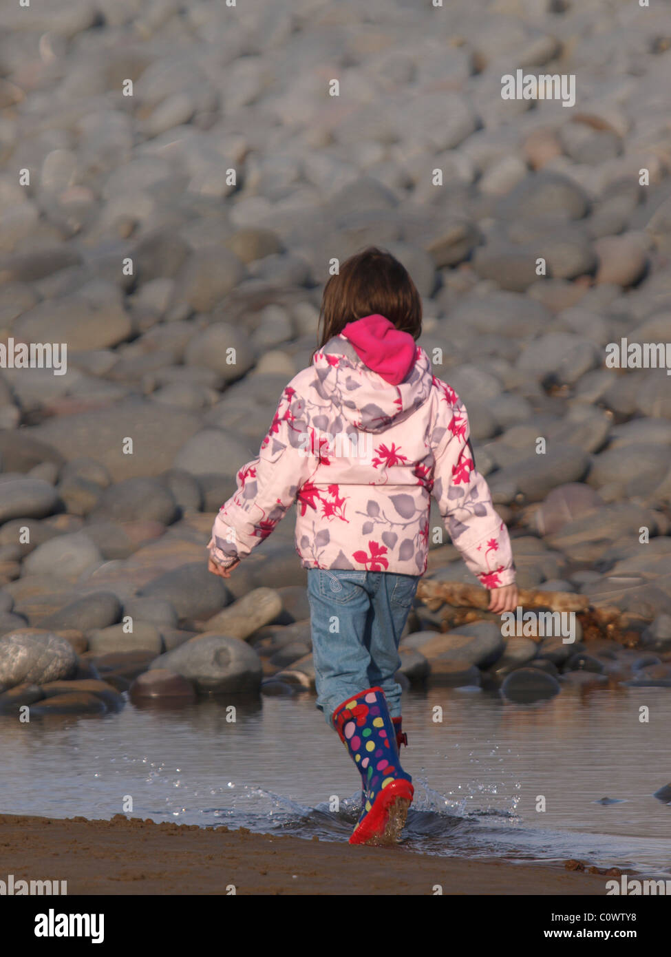 Young girl at the beach, Devon, UK Stock Photo - Alamy