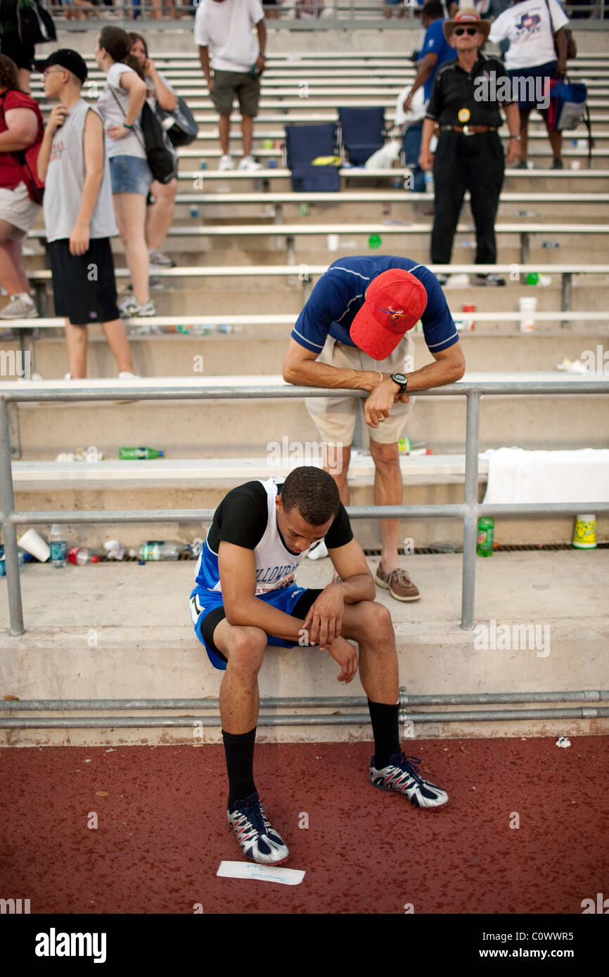Father talks to his downcast son after disappointing finish in race at ...