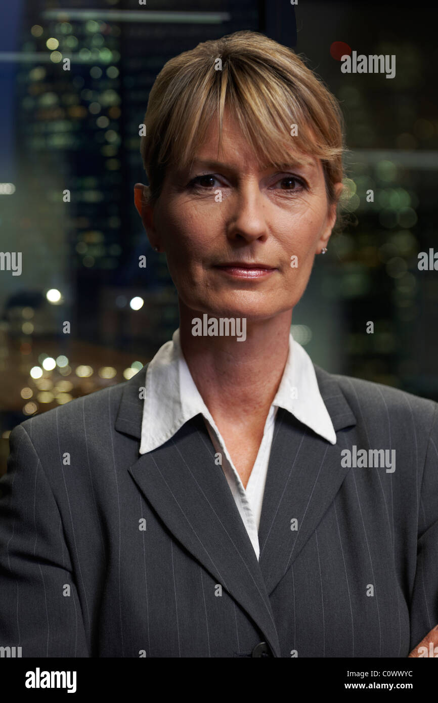 Portrait of a senior executive by a window looking at camera Stock ...