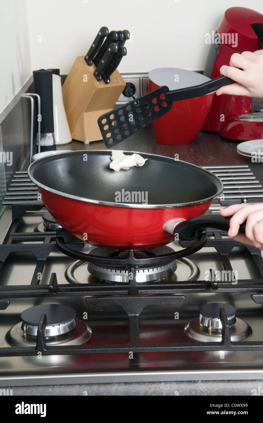 Detail of a cooking pan in a modern kitchen Stock Photo - Alamy