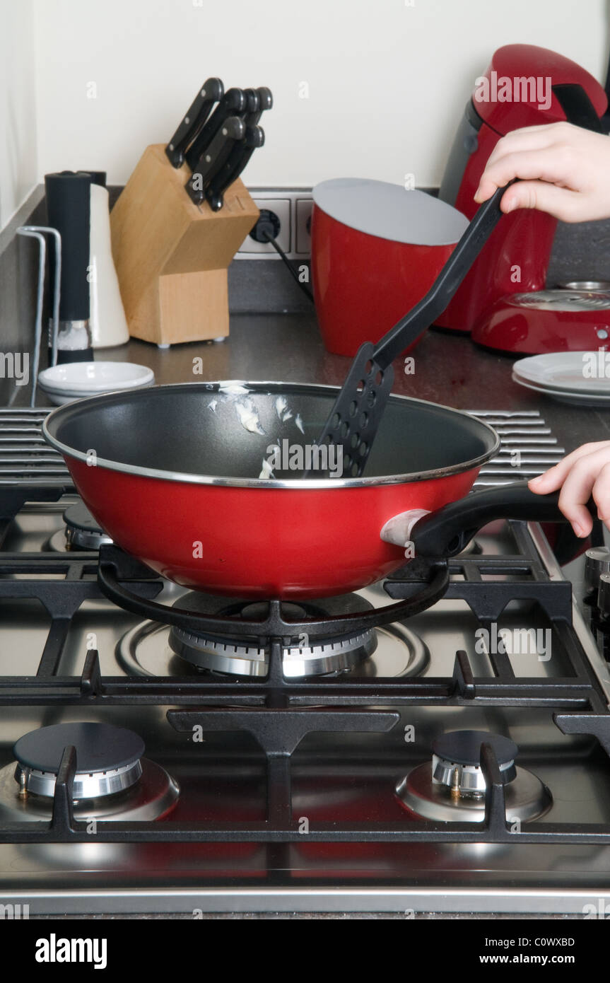 Detail of a cooking pan in a modern kitchen Stock Photo - Alamy