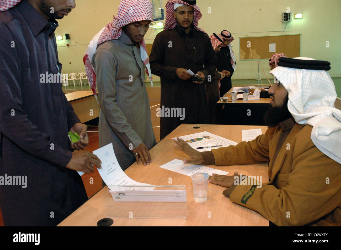 A voter gets voting pointers from a voting official during historic ...