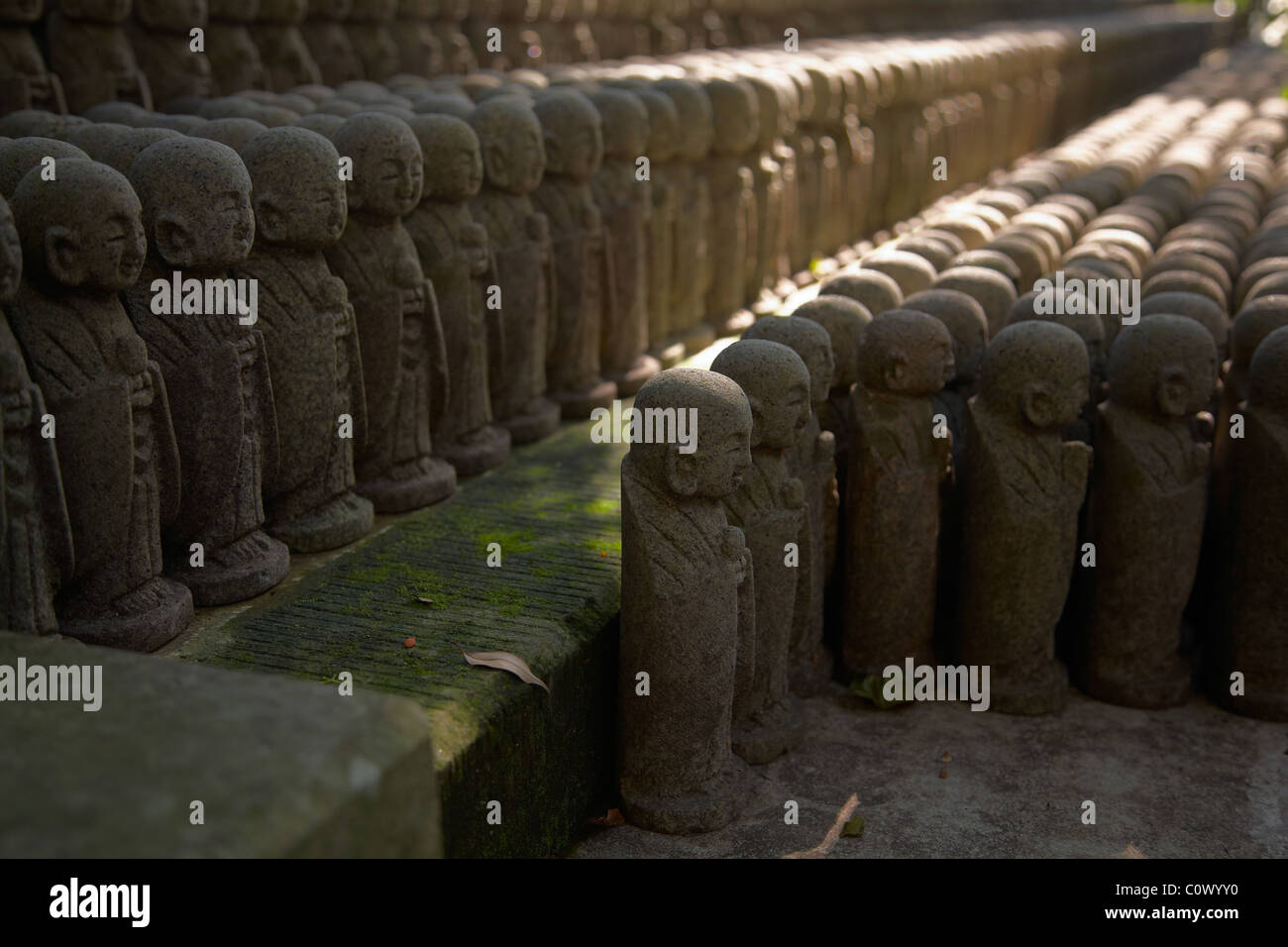 Stone monks statues Stock Photo - Alamy