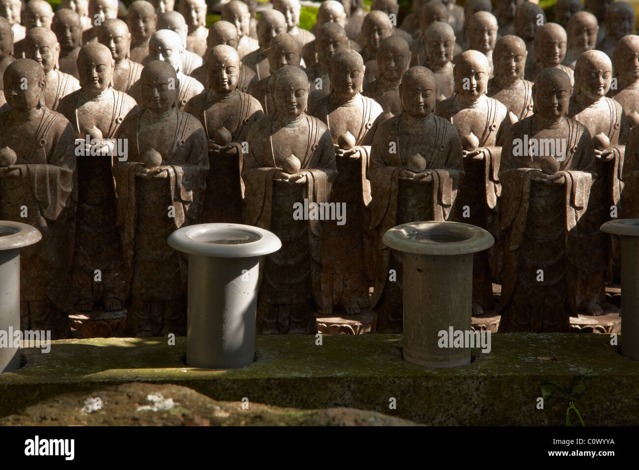 Stone monks statues Stock Photo - Alamy