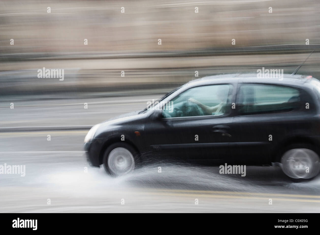 Car in puddle hi-res stock photography and images - Alamy