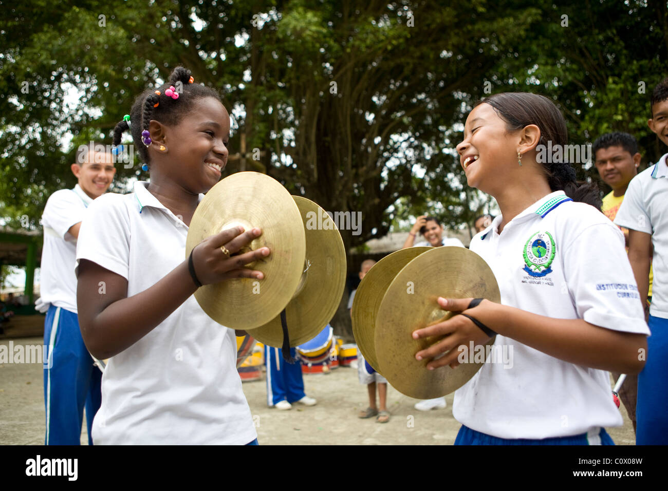 Children from Colombia playing musical instruments. The music project ...