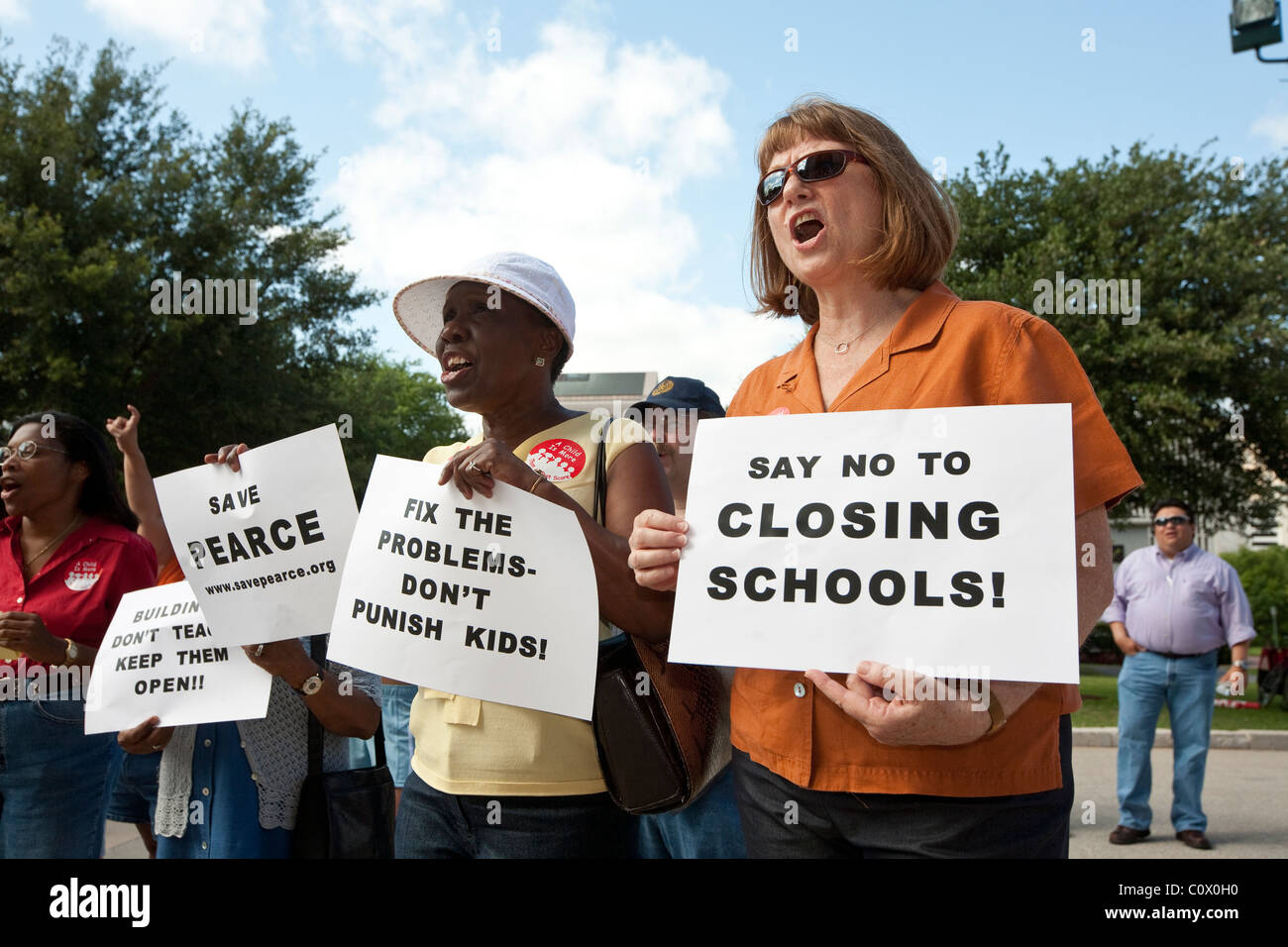 Parents of public school students protest proposed school closures due ...