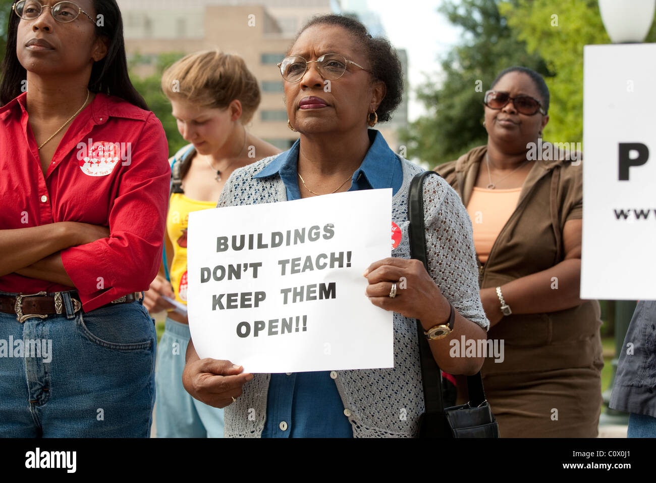 Parents of public school students protest proposed school closures due ...