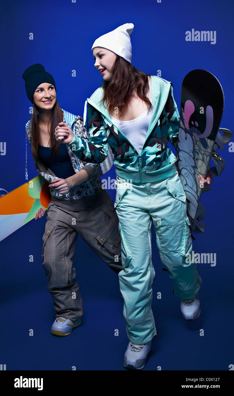 two girls with snowboards Stock Photo - Alamy