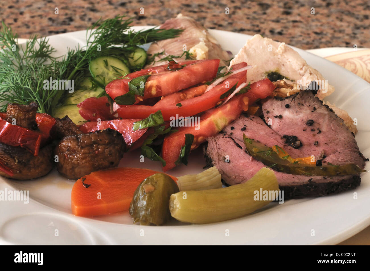 Plate with mix cold food Stock Photo - Alamy