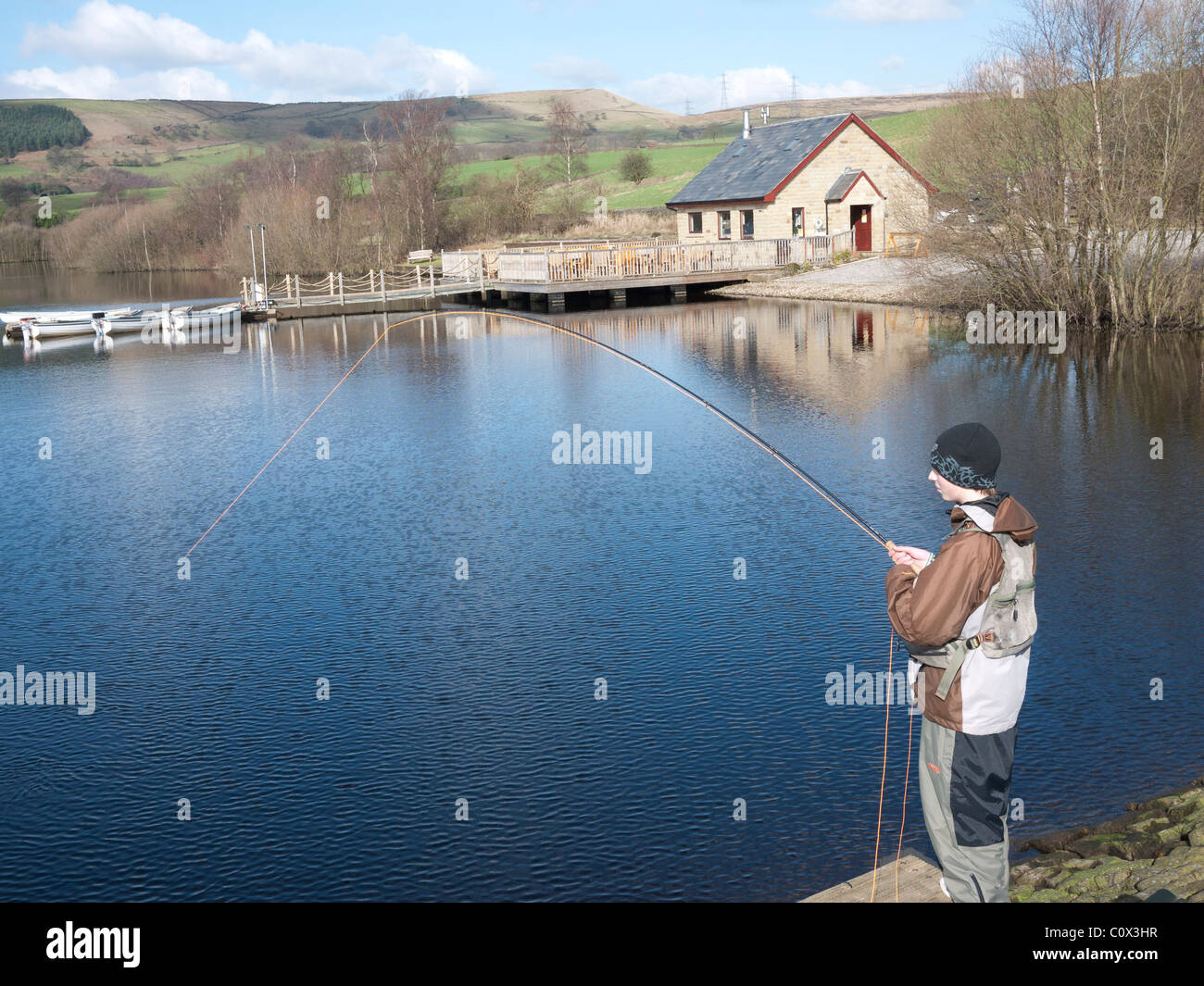 Young angler playing a fish hi-res stock photography and images - Alamy