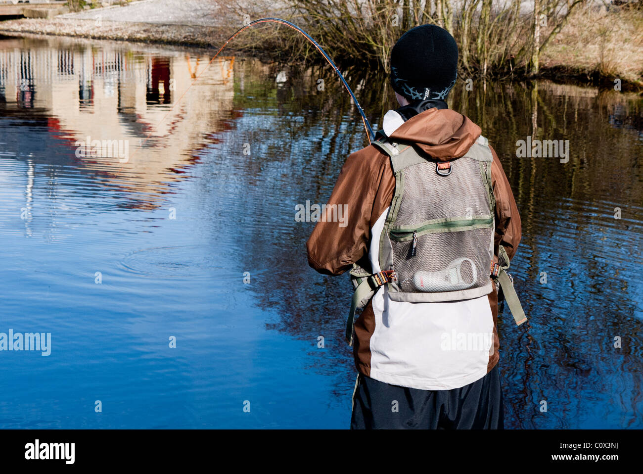 Young angler playing a fish hi-res stock photography and images - Alamy
