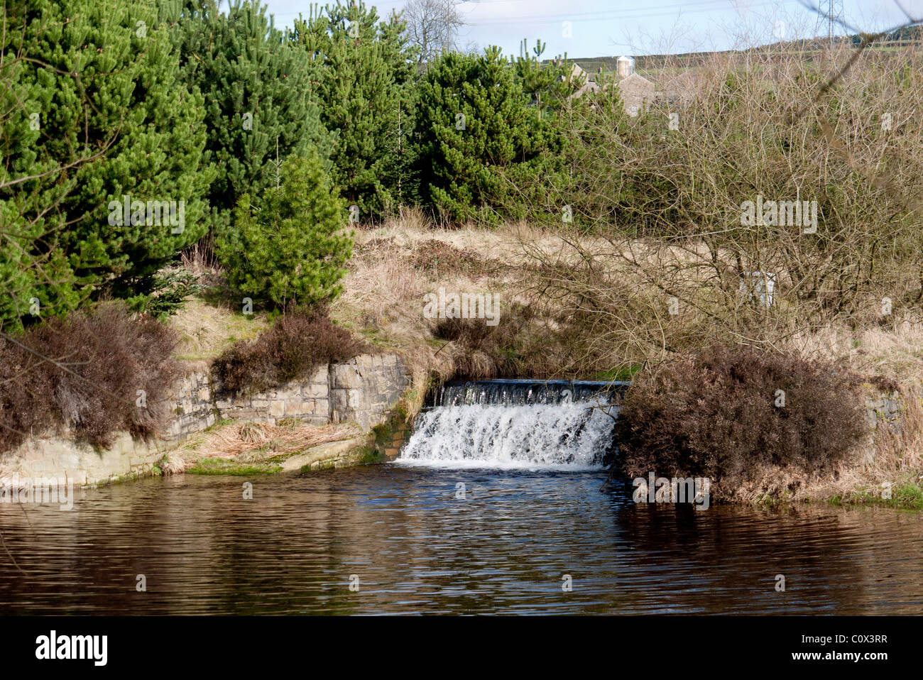 Stream and waterfall running into lake, Derbyshire, England, UK Stock ...