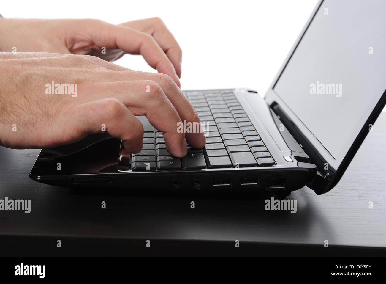 Hands on the laptop keyboard Stock Photo - Alamy