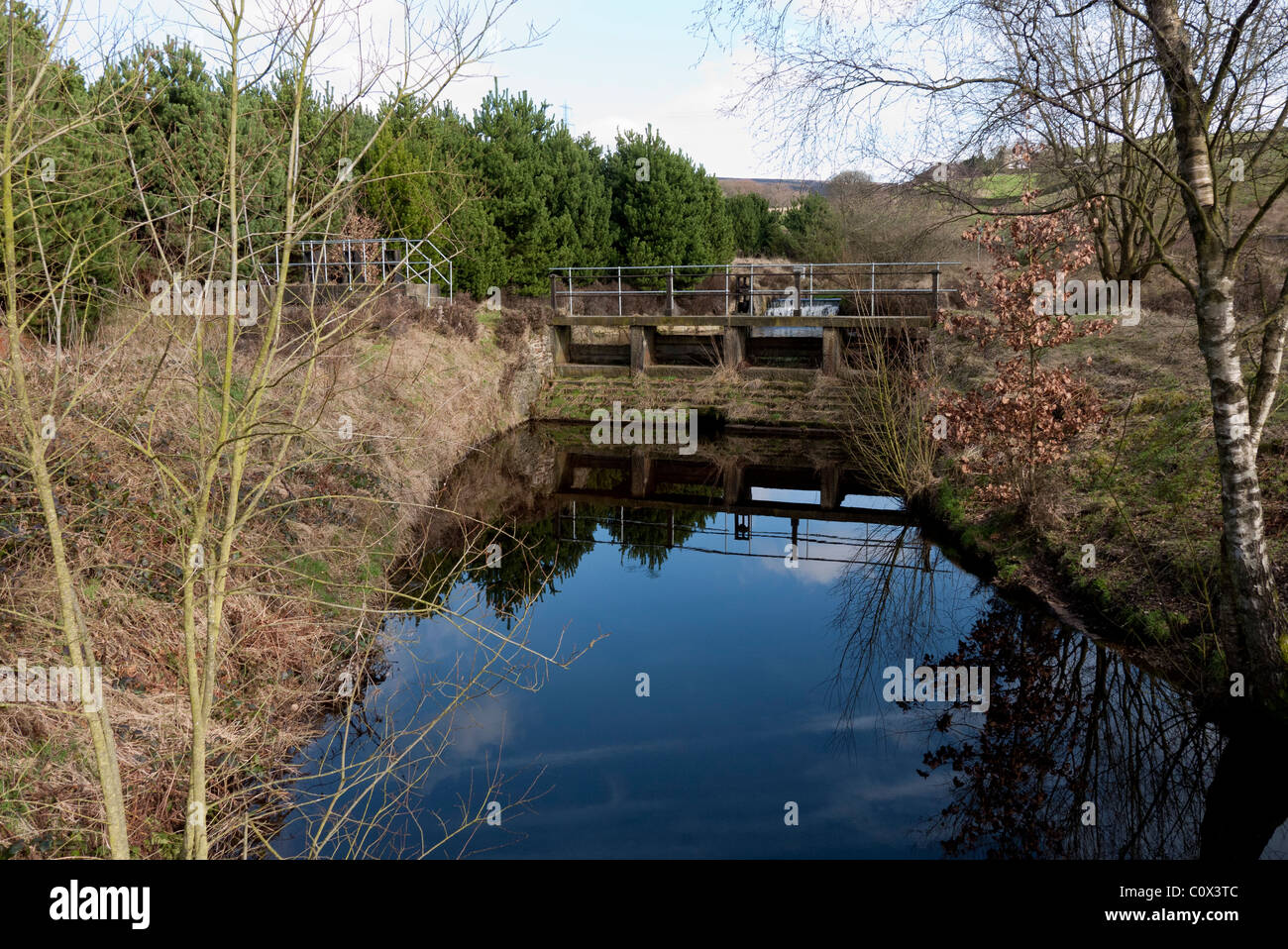 Damned stream and footbridge, Tintwistle, Derbyshire, England, UK Stock ...