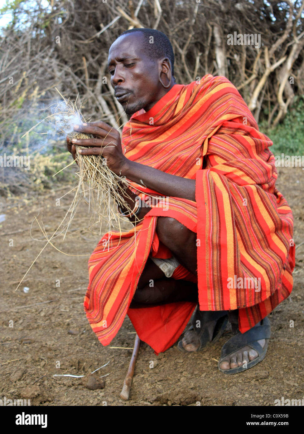 Masai Man setting fire Stock Photo - Alamy