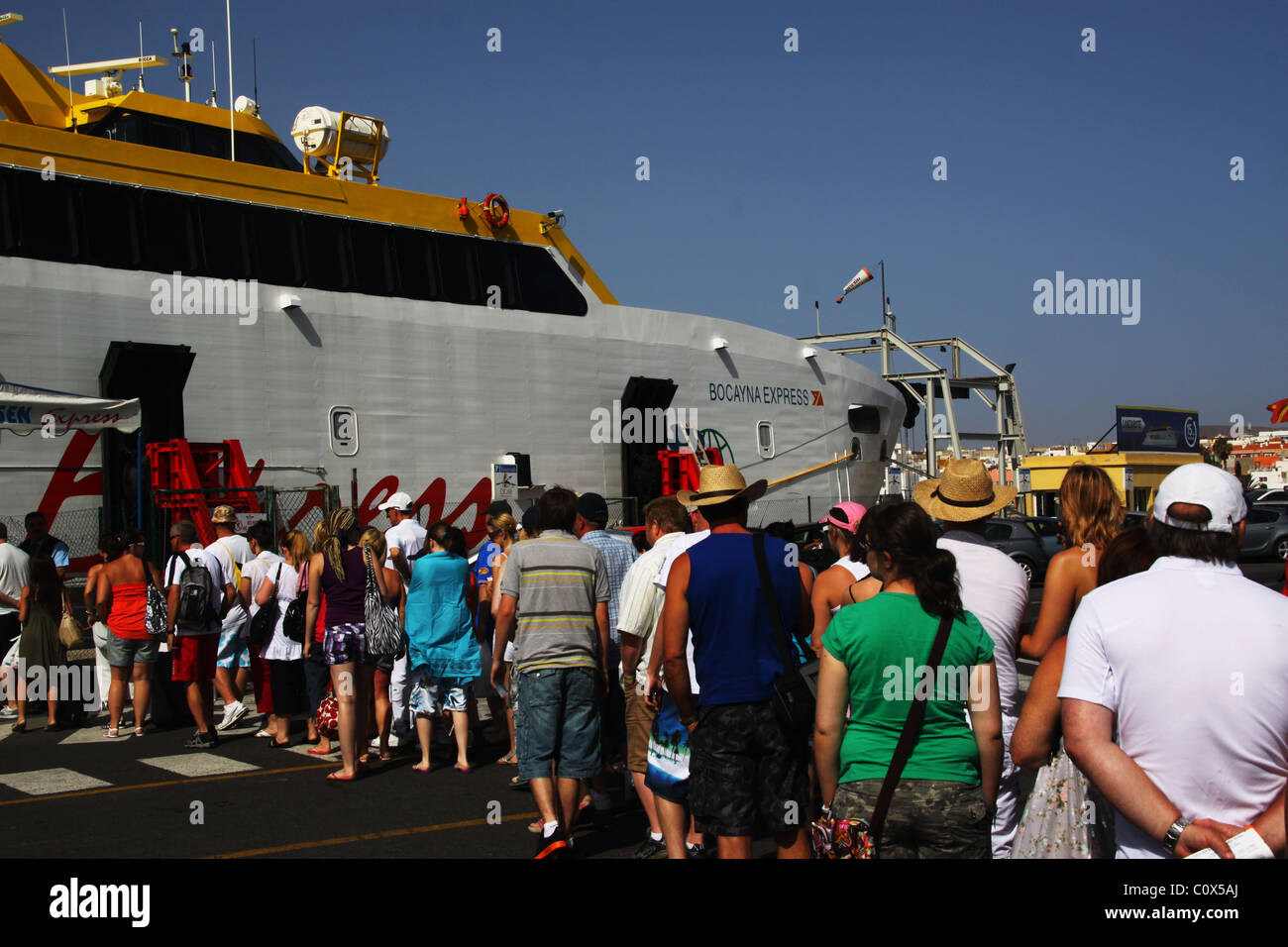 Queue of passengers boarding ferry Stock Photo - Alamy