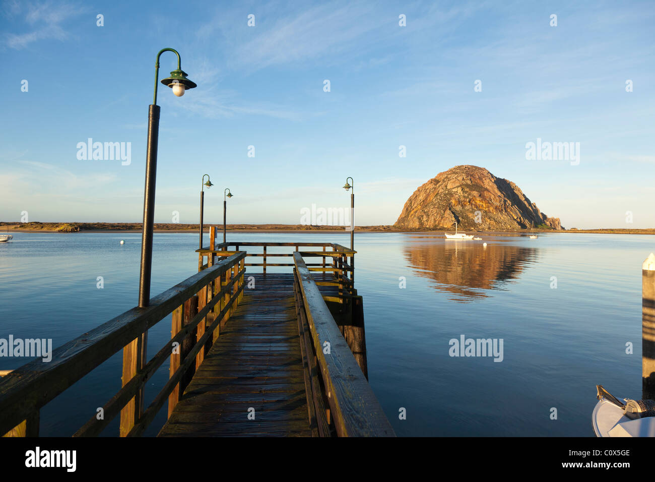 Morro Rock in Morro Bay, California with Morro Bay in foreground. Pier ...