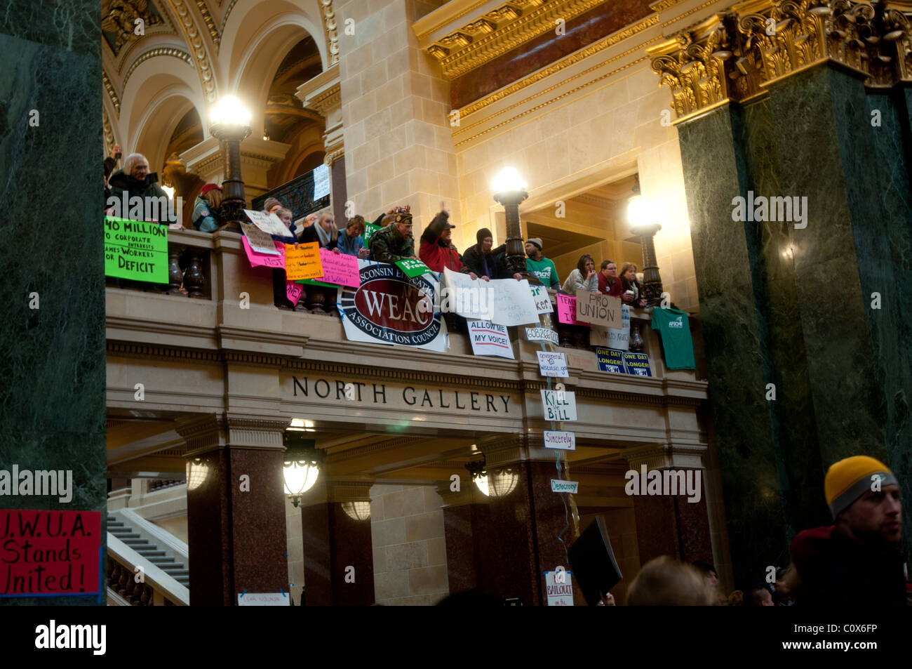 Protesters merge on the capitol in Madison, Wisconsin to fight the ...