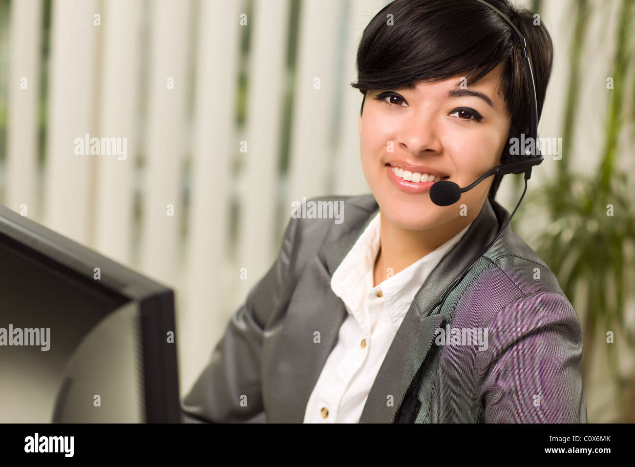 Attractive Young Woman Smiles Wearing Headset Near Her Computer Monitor ...