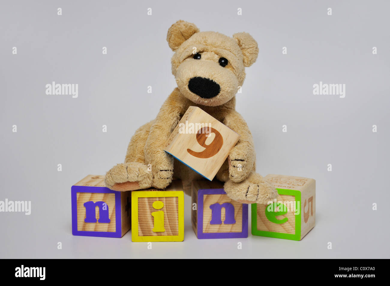Teddy bear with cubes Stock Photo - Alamy